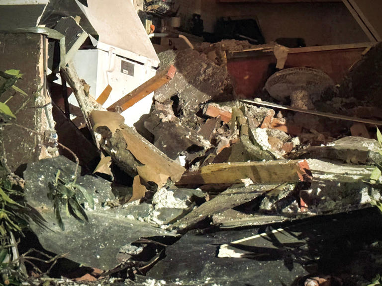 Car crashes into Gresham apartment complex, displacing family