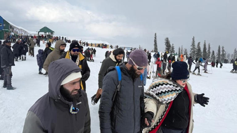 Snow turns Gulmarg into winter wonderland, tourists turn skiers, ride ...