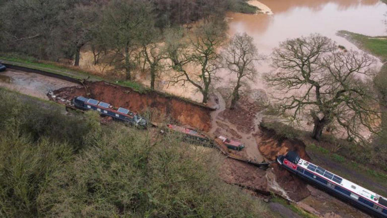 In pictures: Canal bursts to leave giant hole