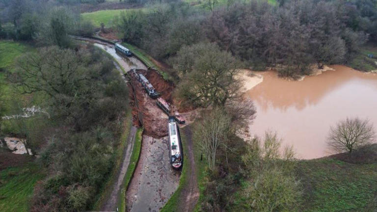 In pictures: Canal bursts to leave giant hole