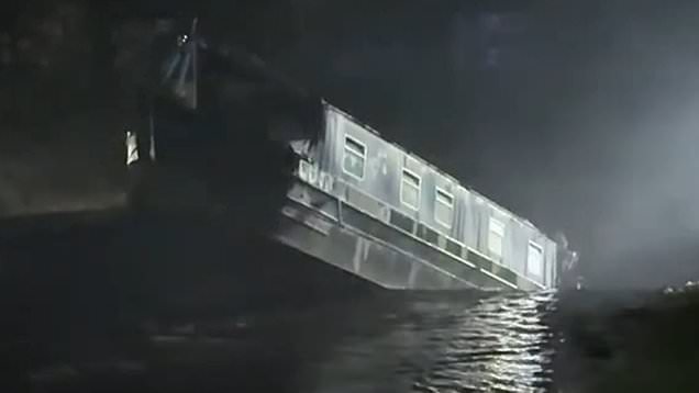Moment canal collapse swallows houseboat