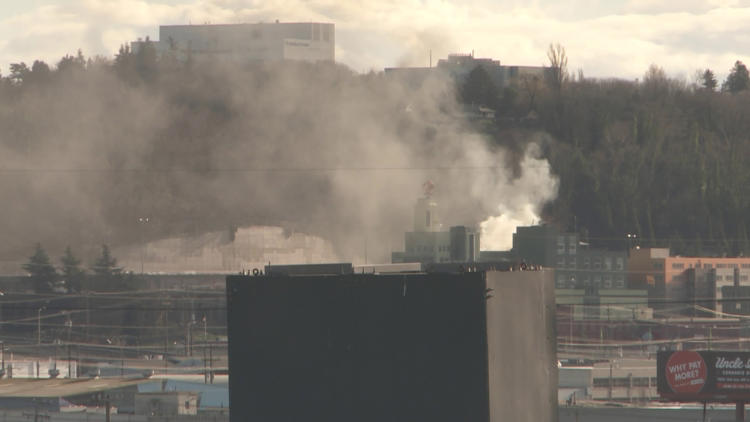 Fire crews at the scene of vehicle blocking 2 lanes of NB I-5 in Seattle
