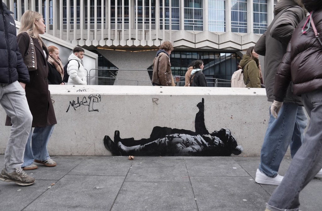 Just in time for Christmas, identical new Banksy murals look to the ...