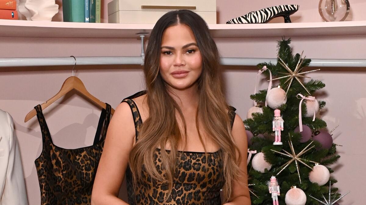 Chrissy Teigen loses a tooth in family Christmas activity gone wrong