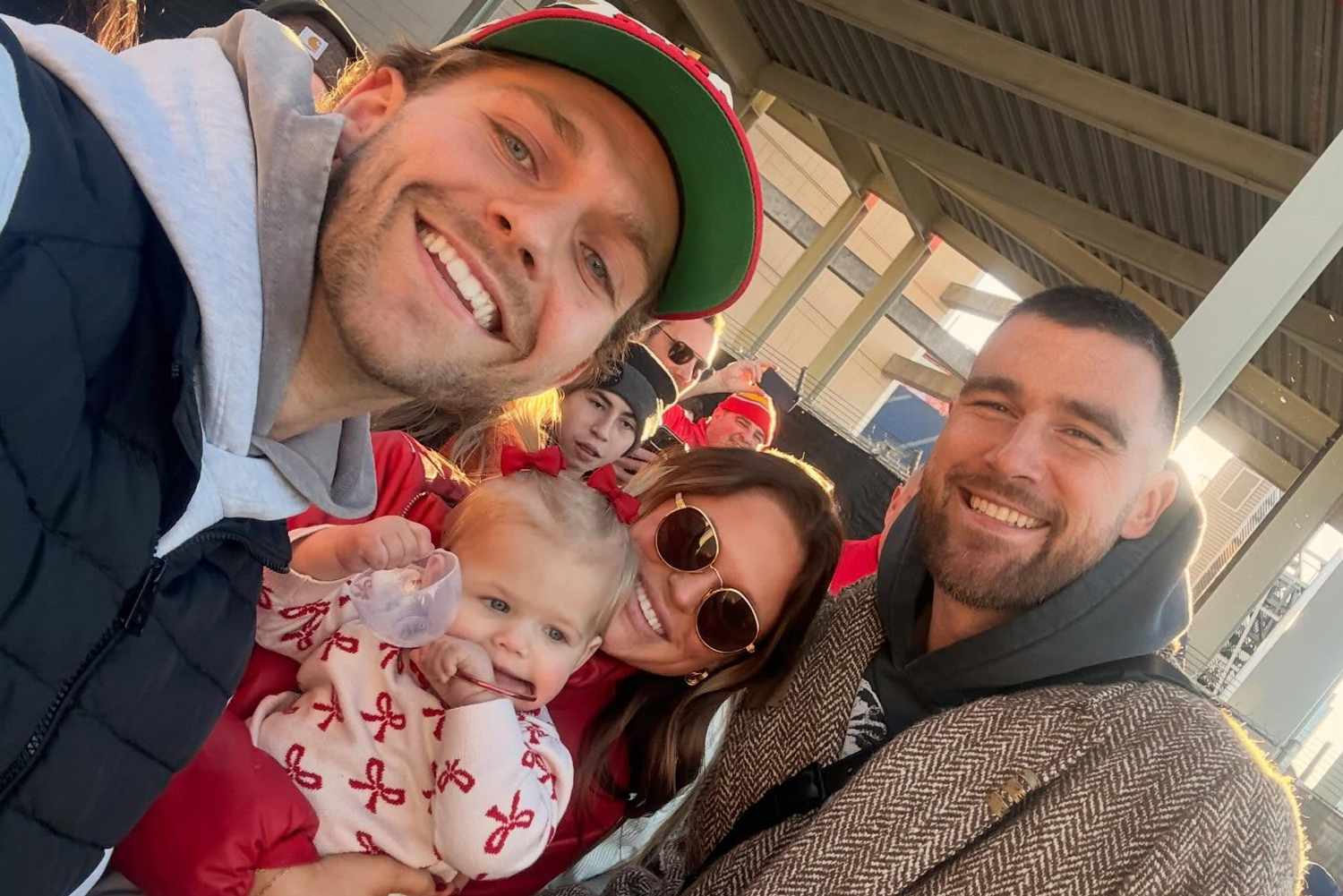 Travis Kelce poses for pictures with his friends as they attend what ...