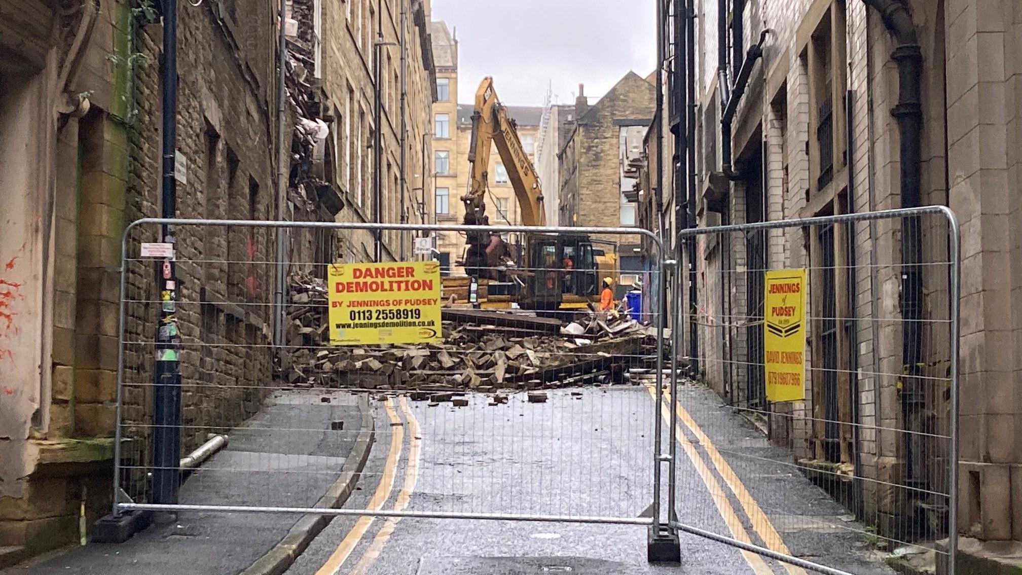 Demolition begins after partial building collapse