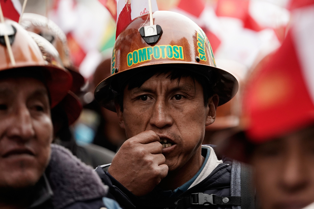 Workers organized by a key union rally in Bolivia against scrapping ...