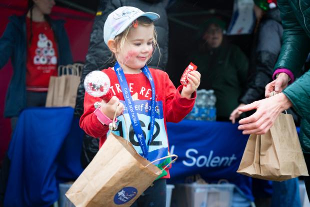 Hundreds of runners dressed as elves take part in festive run