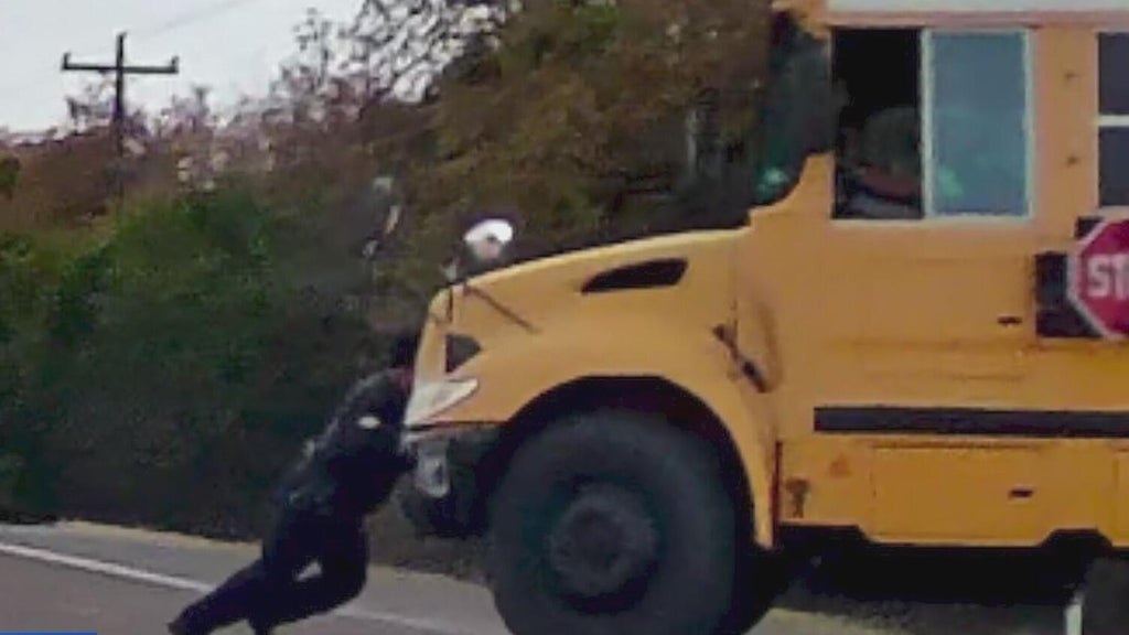 Viral video shows Texas officer pushing stalled school bus full of ...