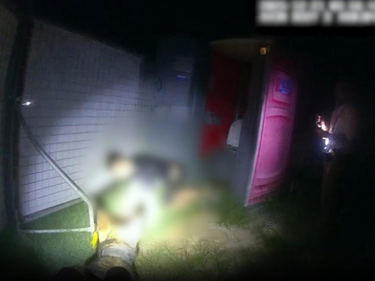 Moment teen arrested hiding in portaloo