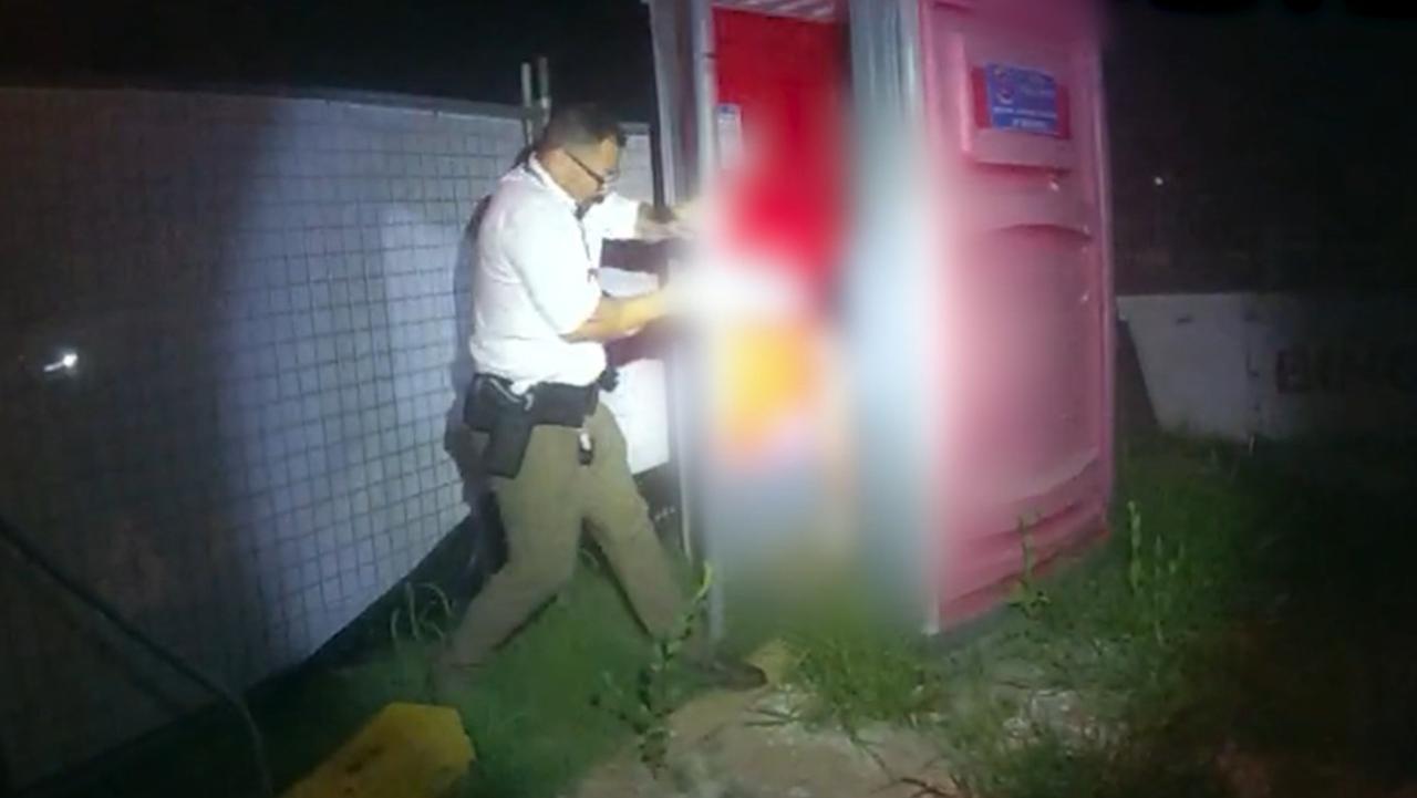 Moment teen arrested hiding in portaloo
