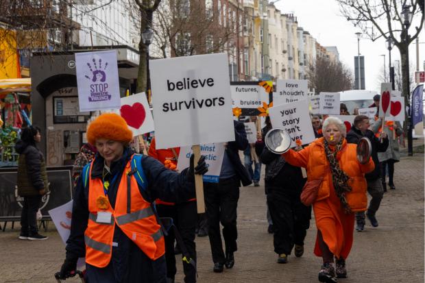 Women march in solidarity to demand an end to gender-based violence