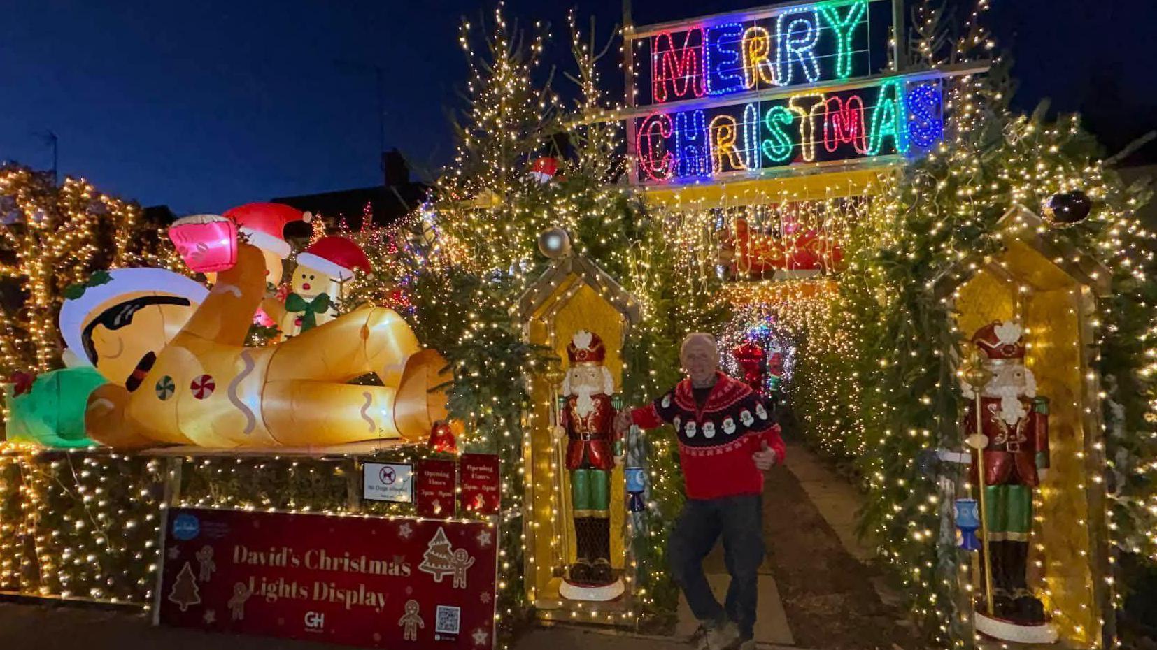 Grandfather brings festive joy with Christmas light display