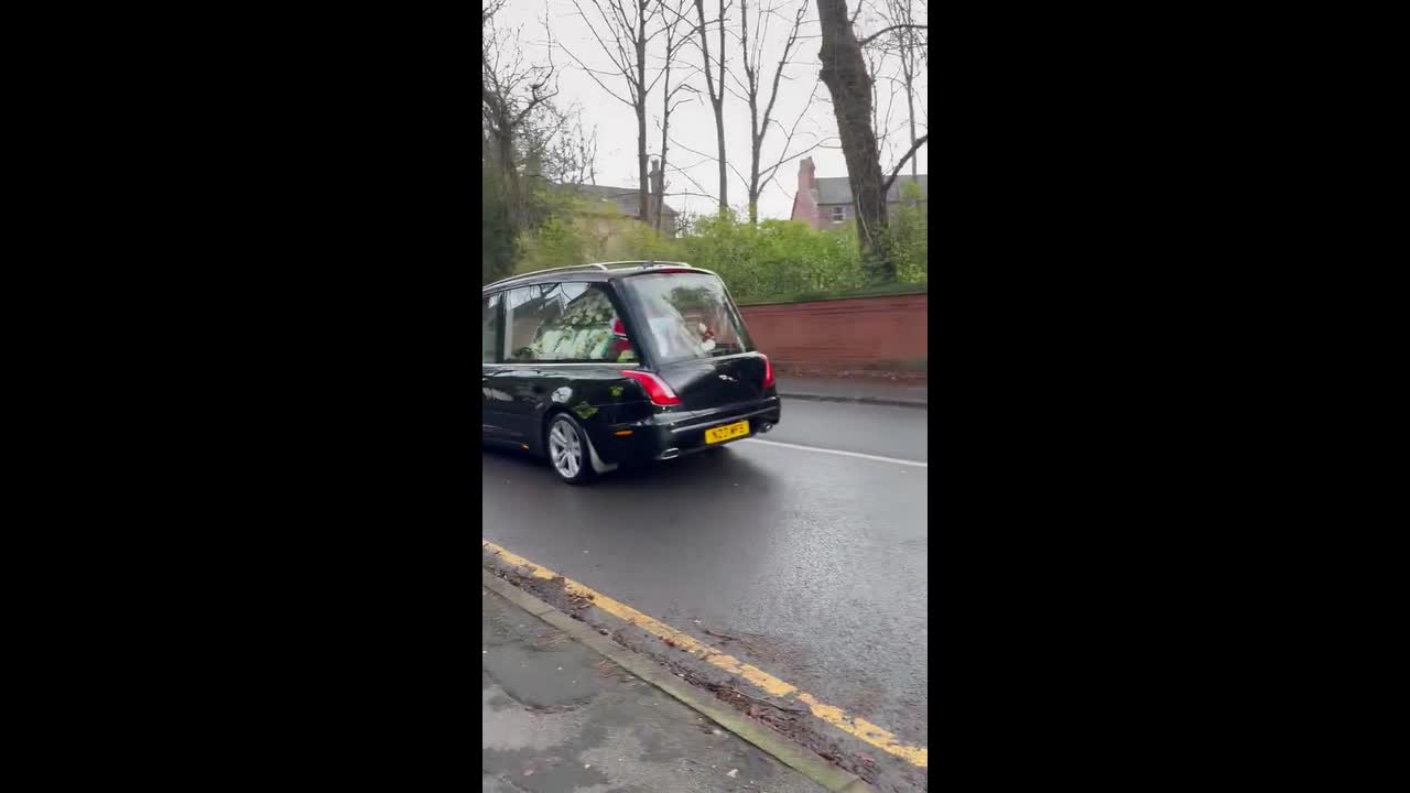 Funeral procession honors Stone Roses bassist Mani in Manchester, UK