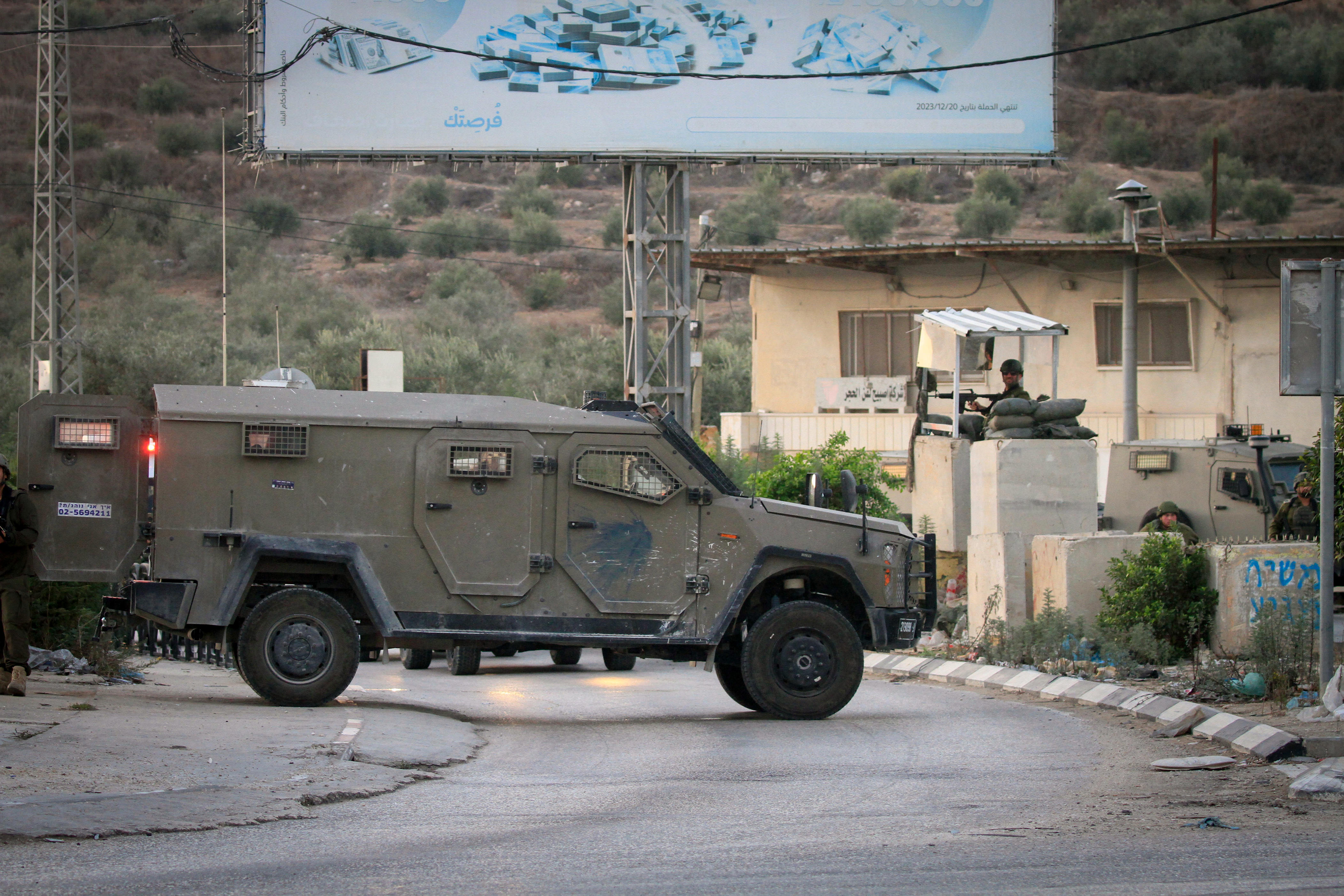 Three injured after vehicle attempts to evade security check near ...