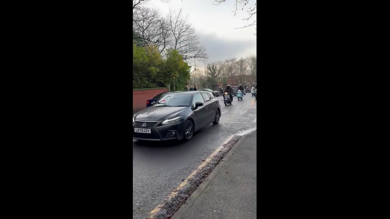 Funeral procession honors Stone Roses bassist Mani in Manchester, UK