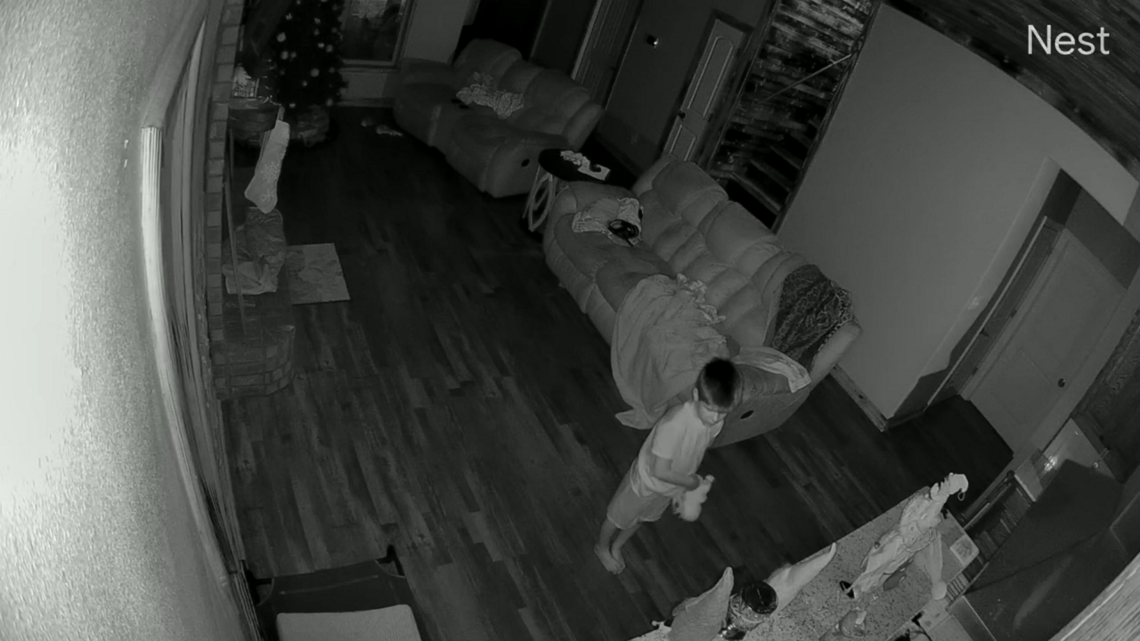 Child startled by moving elf decoration at home in Walker, USA