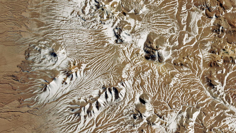 Rare dusting of snow covers one of the driest places on Earth and shuts ...