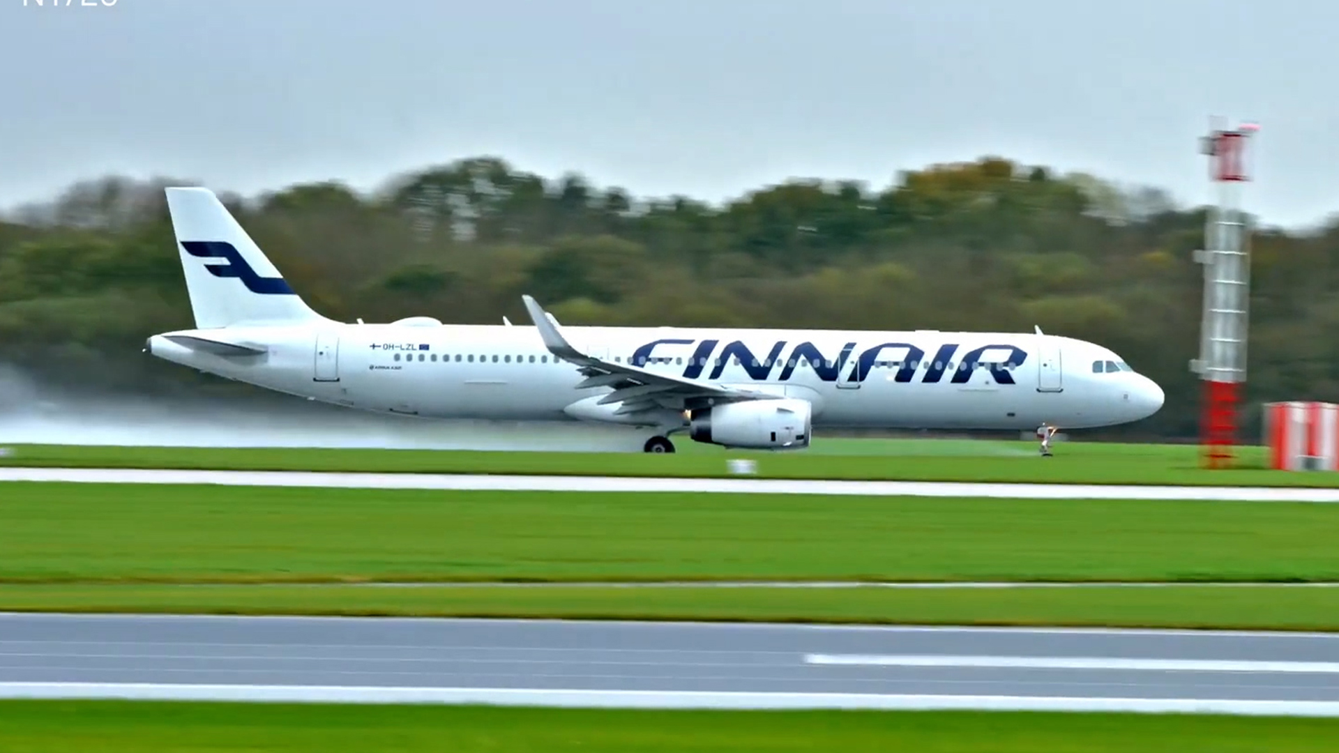 Planes taking off through heavy rain and water spray