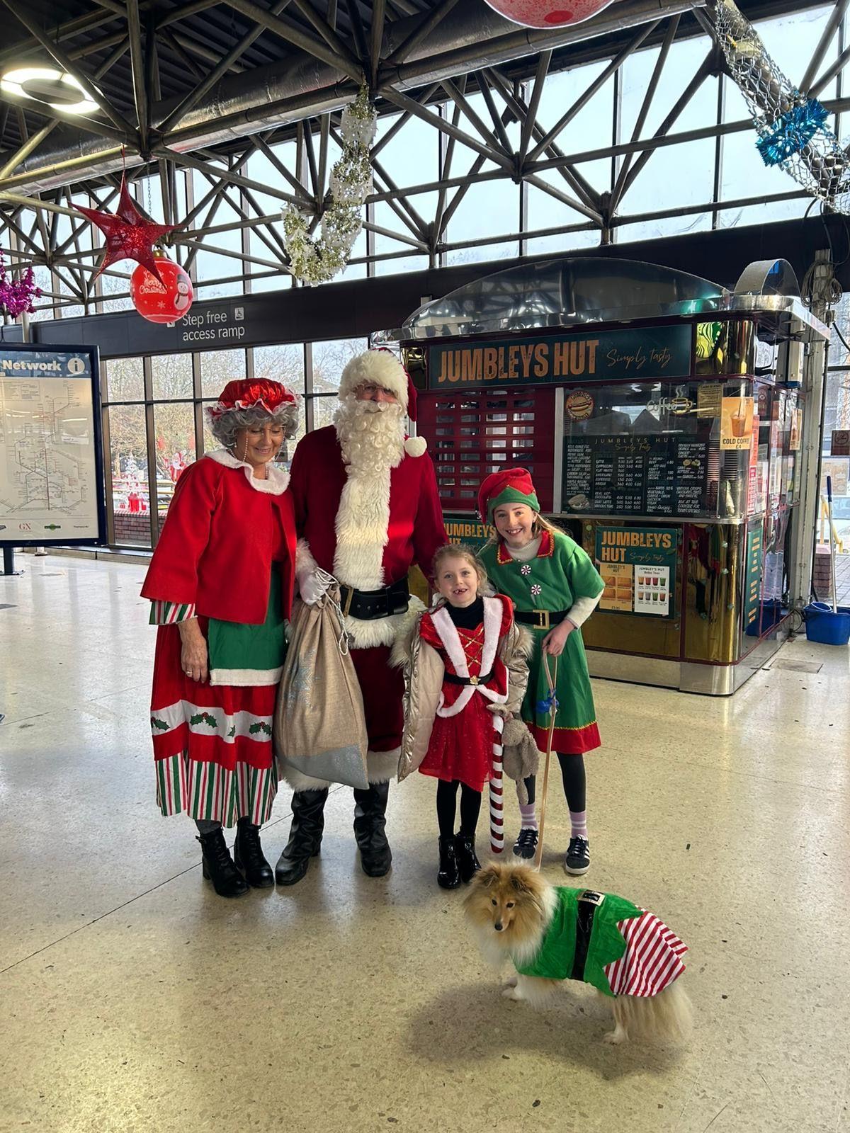 Santa and Mrs Claus surprise children at Bedford Station