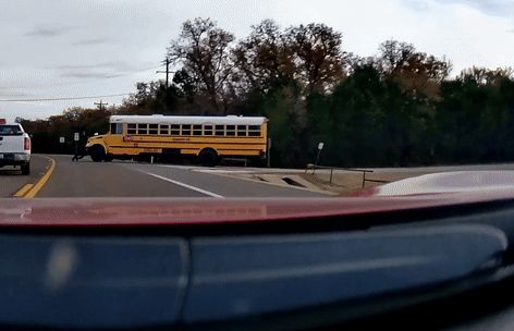 'Superman' officer pushes broken-down school bus in North Texas