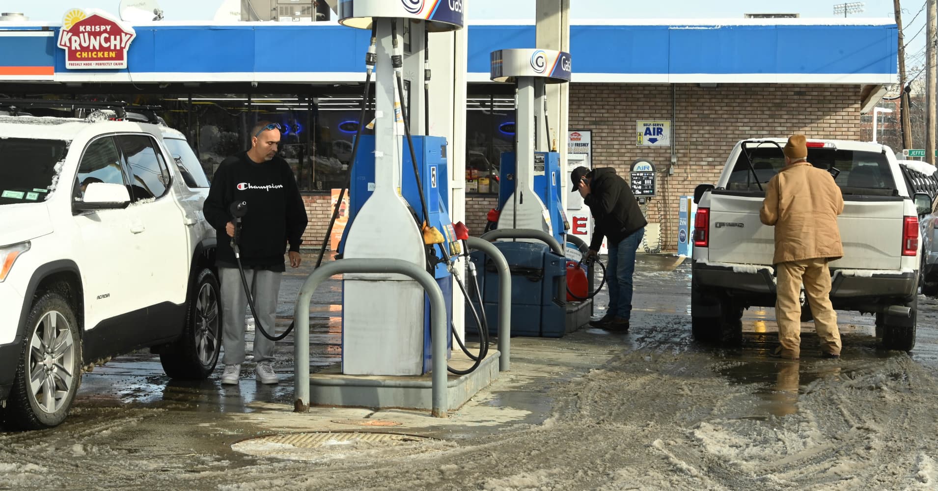 Gas prices fall to four-year lows as millions embark on holiday road trips