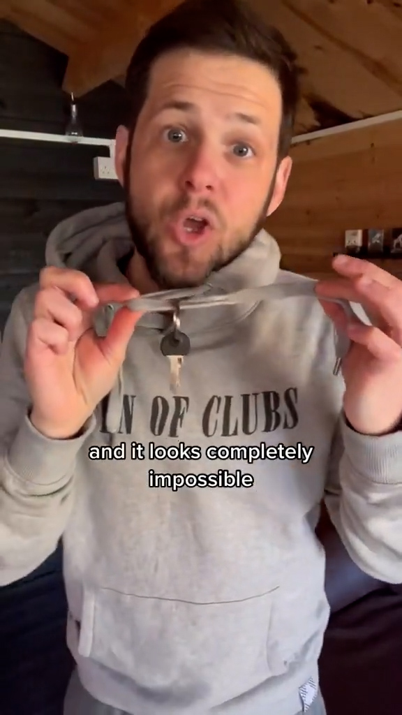 A solid key ring passes through the string