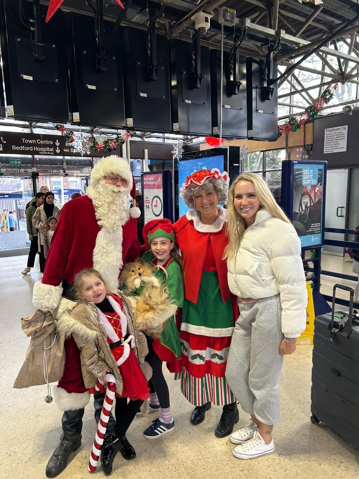 Santa and Mrs Claus surprise children at Bedford Station