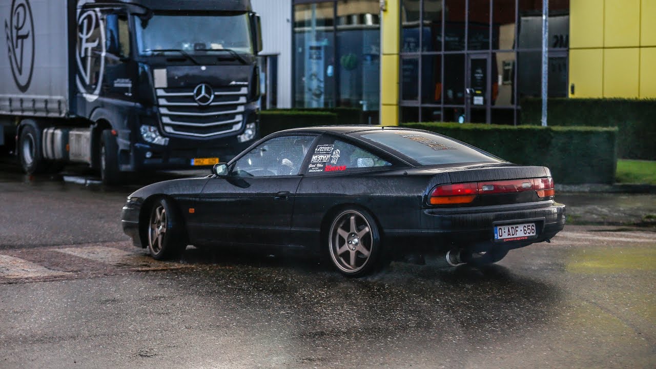 Tuned cars going crazy doing donuts, drifts, burnouts at a car meet