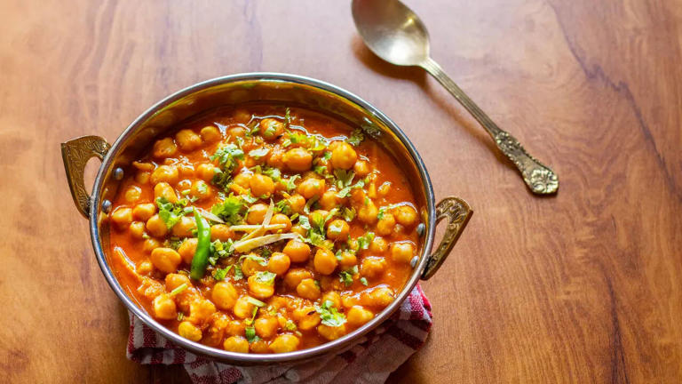 Why do some people add a metal fish to their dals and curries?