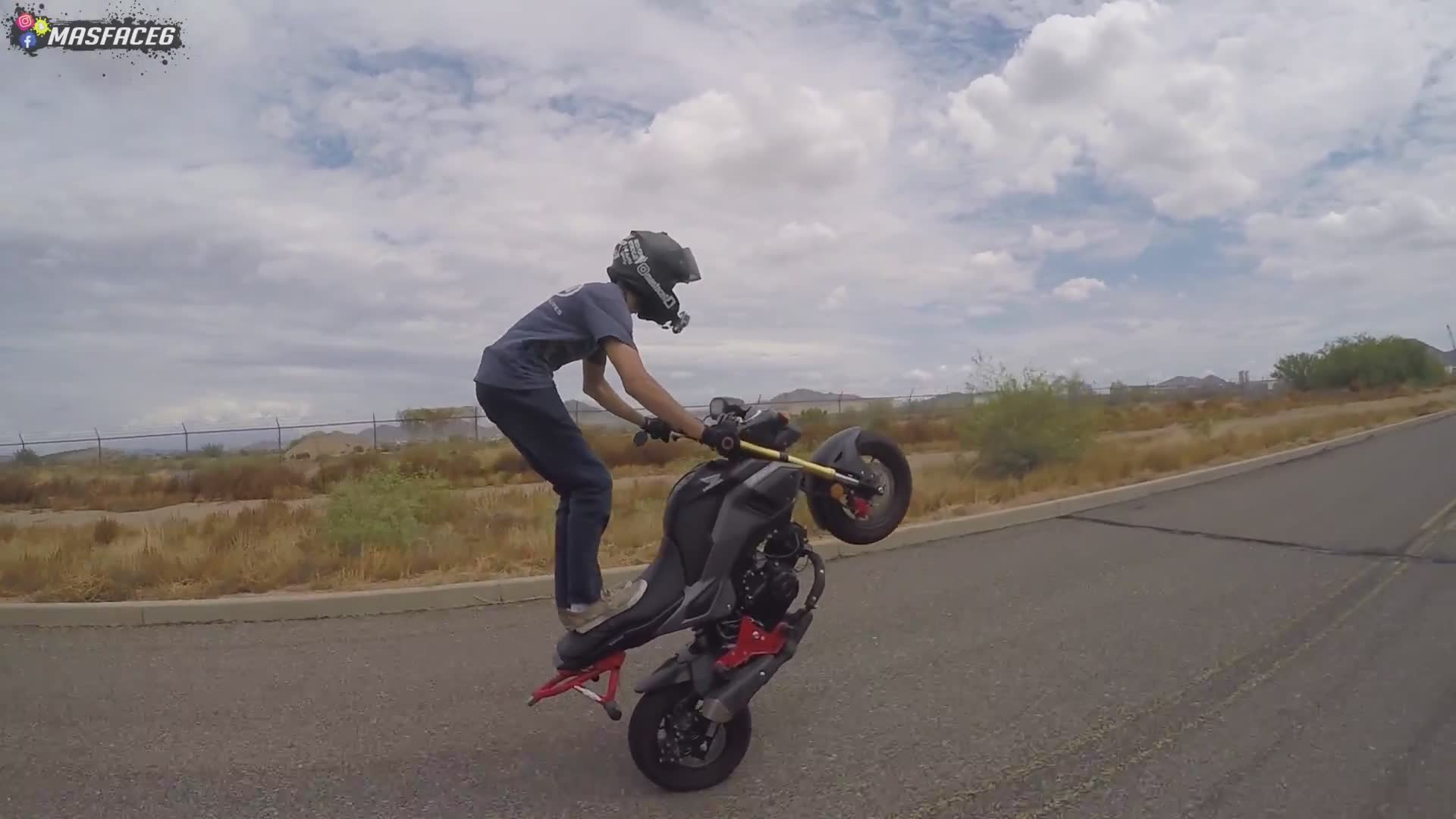 Stylish stunt variation dragging boot on ground during wheelie
