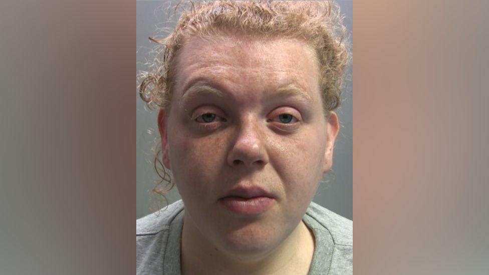 Woman jailed after slashing PC's face with knife