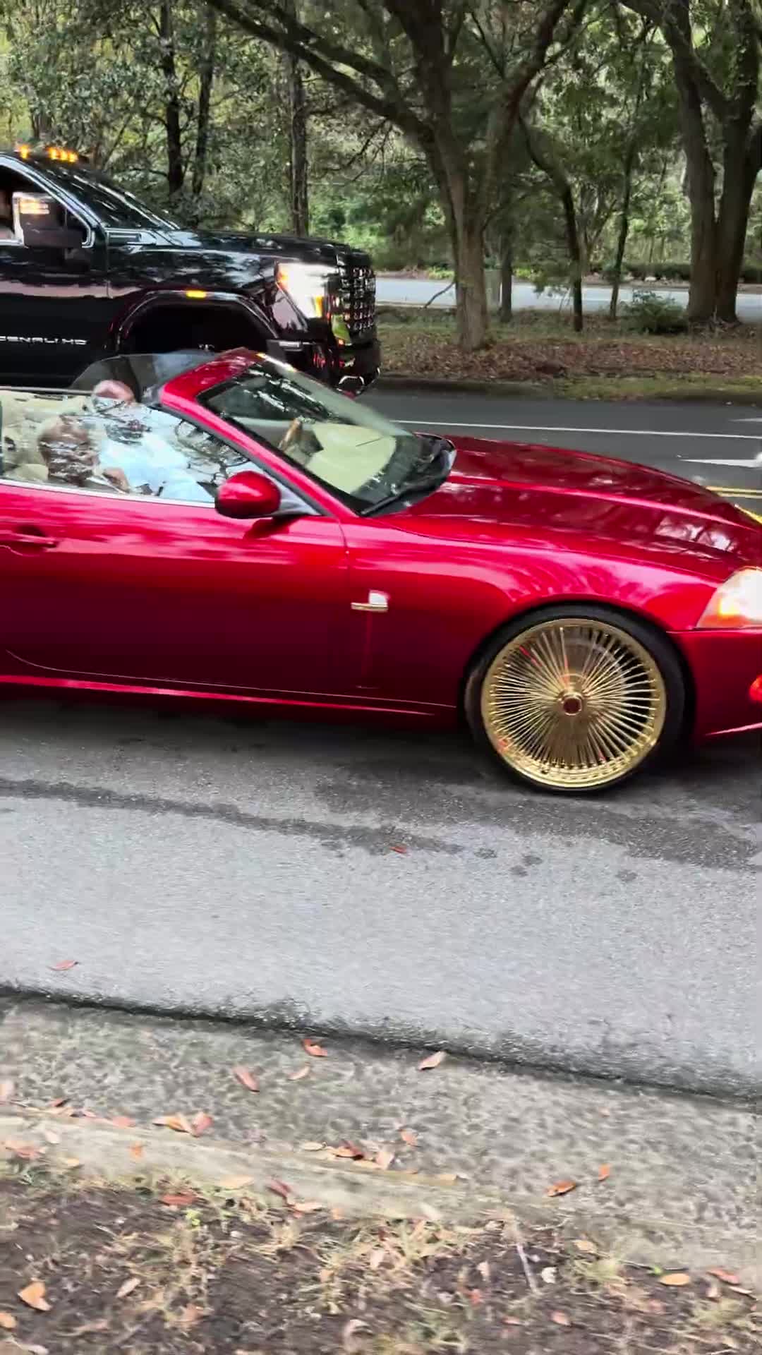 Candy red Jaguar on gold 24’s wire wheels