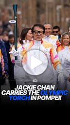 Jackie Chan carries the Olympic torch through the ruins of Pompeii