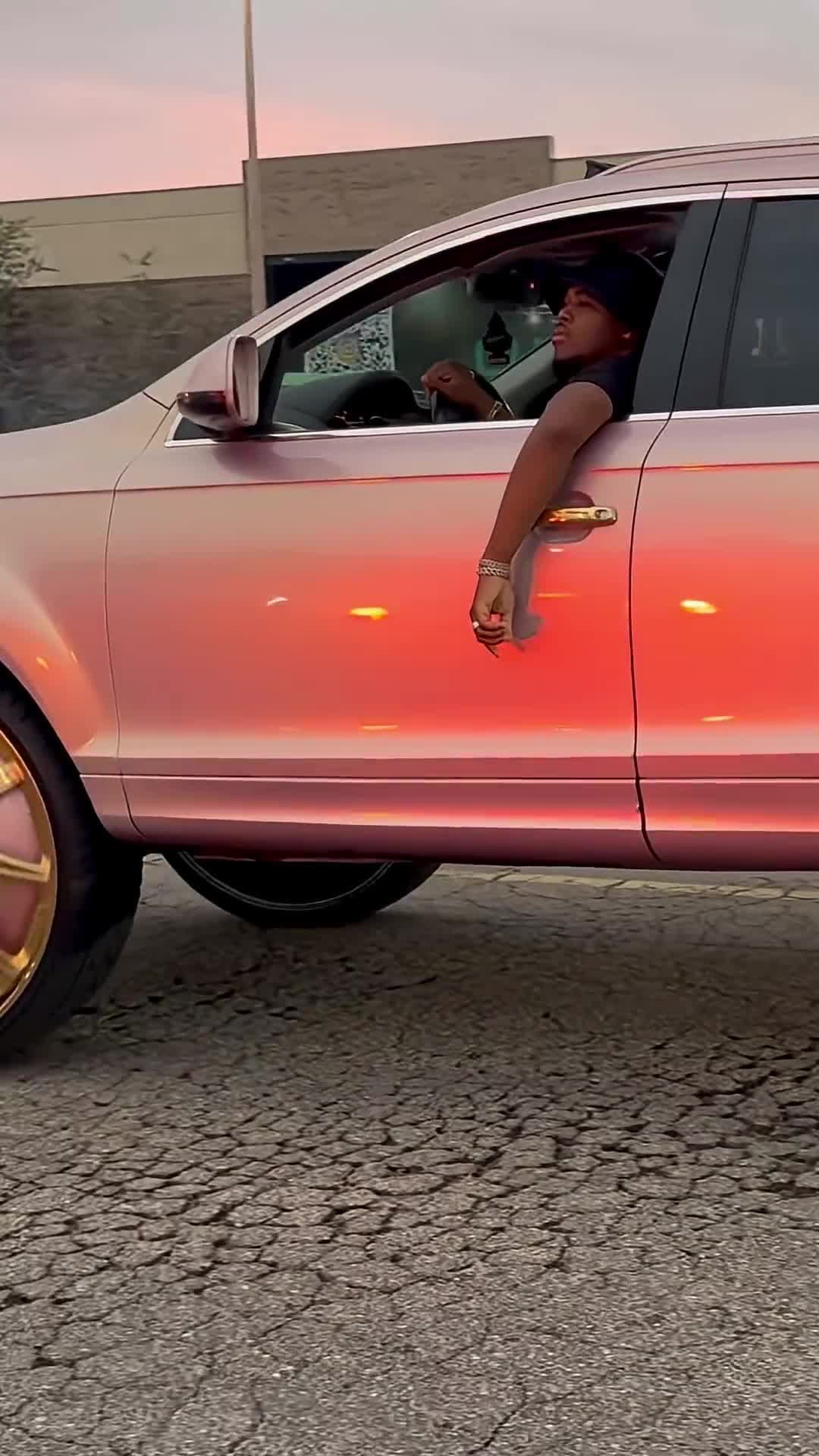 Audi Q7 on gold 32” DUB floaters riding