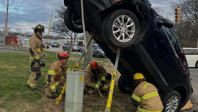 Chattanooga firefighters rescue driver as car dangles from power pole ...