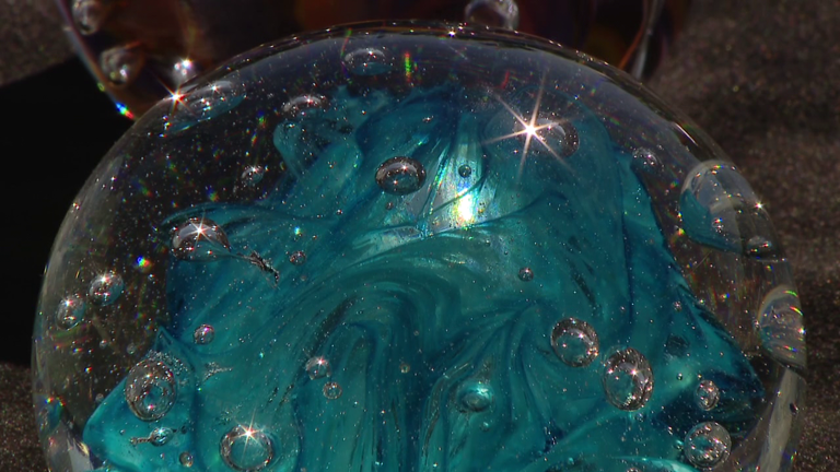 Artist uses molten glass and fire to shape ideas into reality