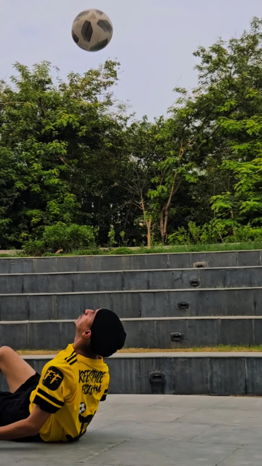 Freestyle football skills performed in an open urban arena