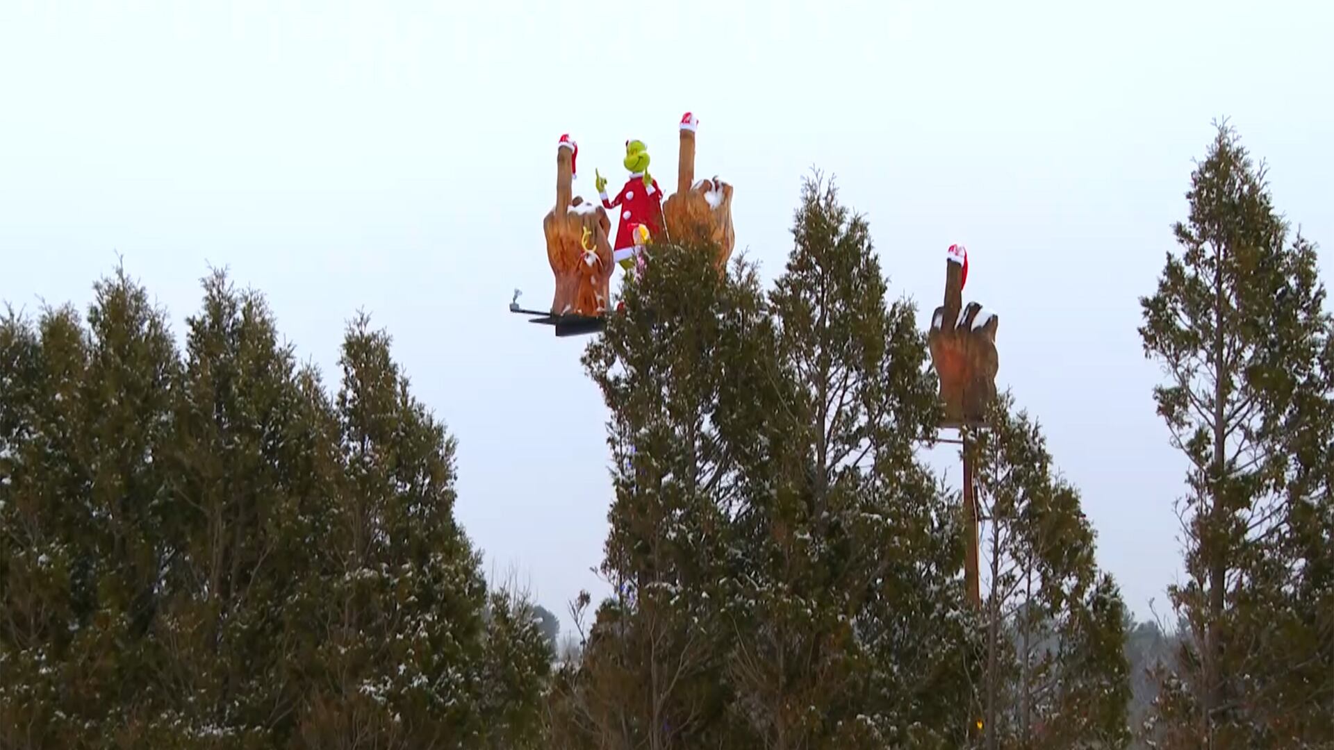 Vt. property owner adds holiday twist to middle finger statue display