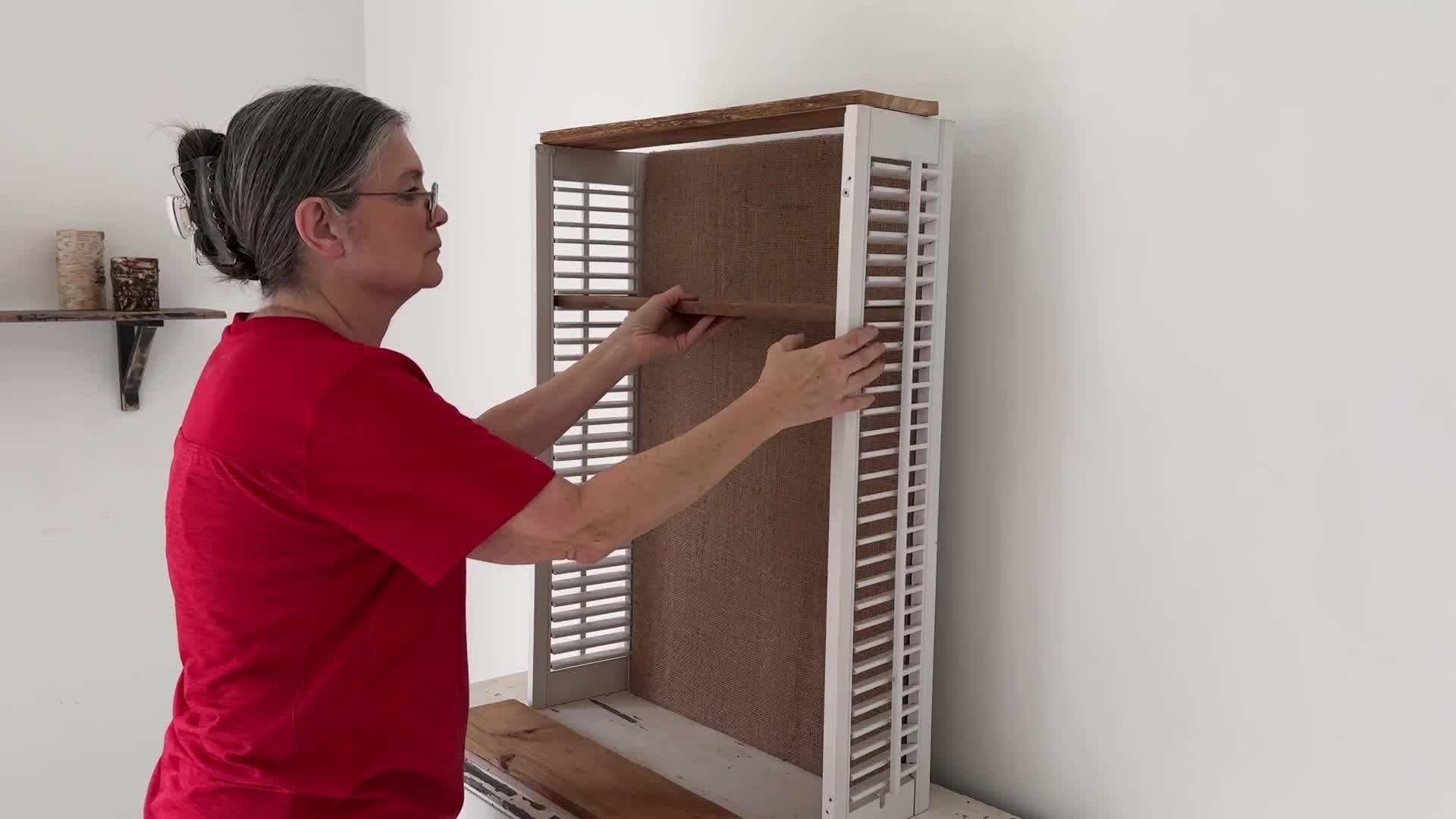 She puts old shutters in her entryway for this brilliant storage idea!