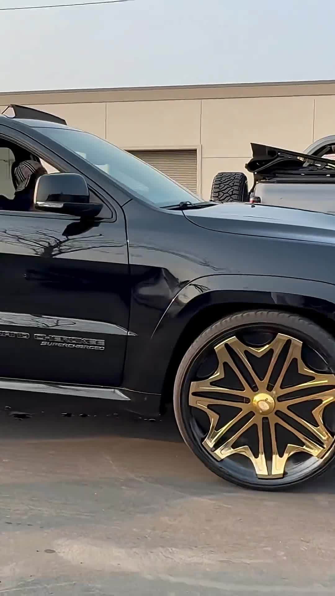Black Jeep Trackhawk on 26’s Davins riding