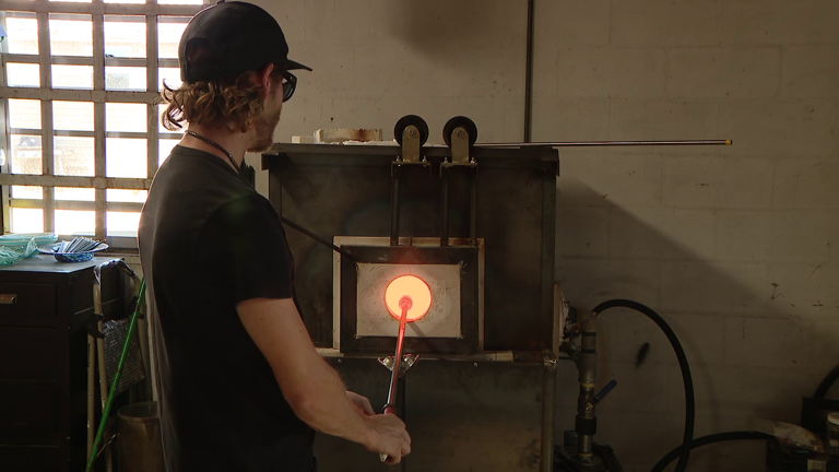Artist uses molten glass and fire to shape ideas into reality