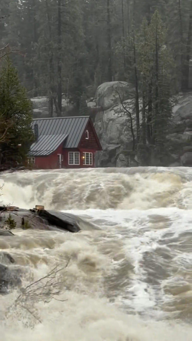 Heroic rescuers slide baby in car seat across raging floodwaters to ...