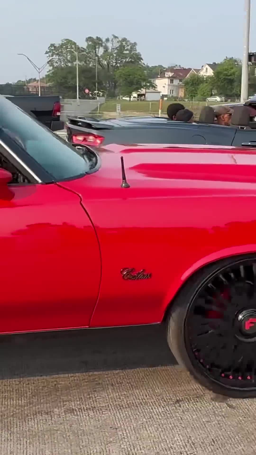 Red Oldsmobile Cutlass on 24’s Riding