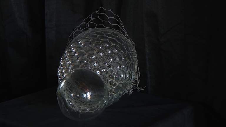 Artist uses molten glass and fire to shape ideas into reality