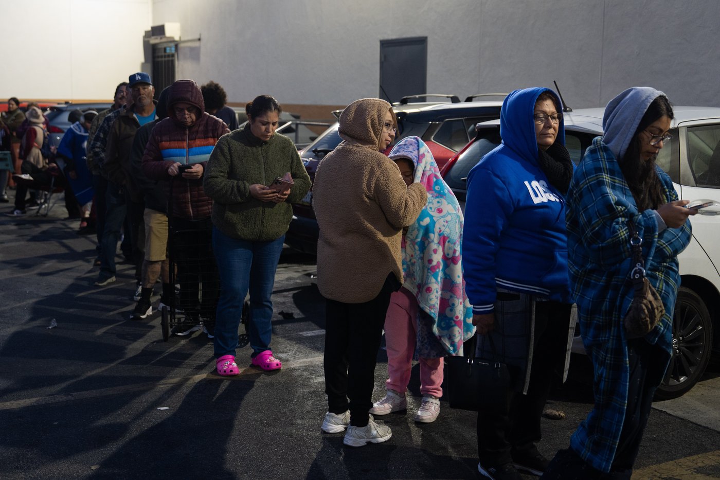Families wait in line for hours to buy masa for Christmas tamales at ...