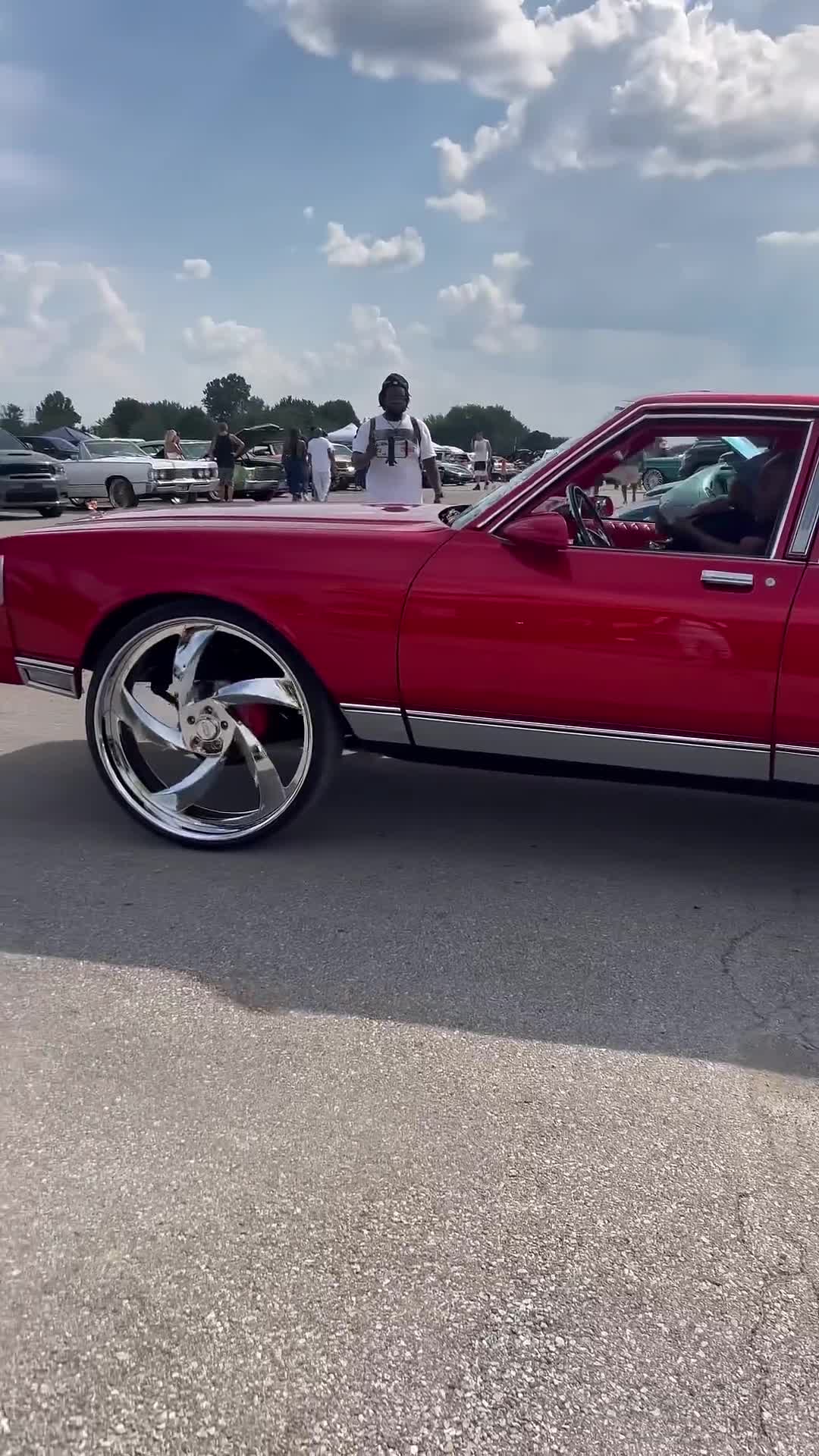 Red box Chevy on 28” billets riding