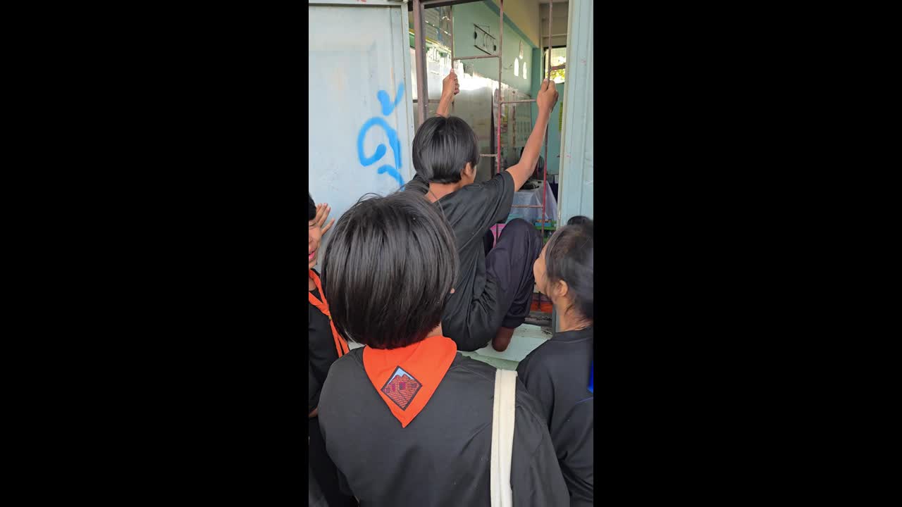 Schoolboy climbs through classroom window bars when teacher forgets key