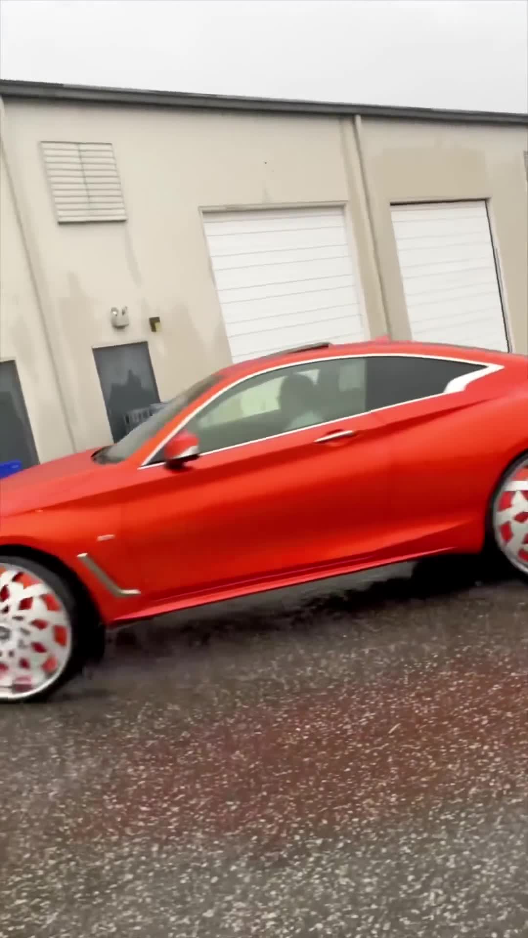Candy red Infiniti Q60 coupe on 26’s DUB floaters