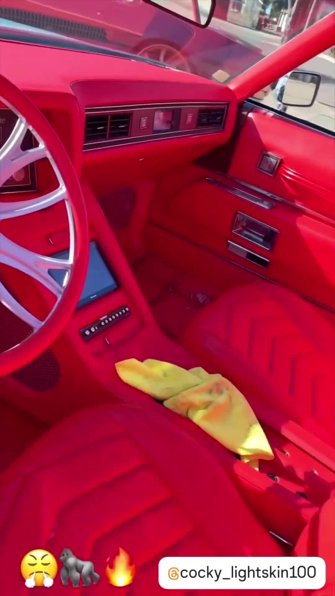 73 Cadillac DeVille on 28”s with the all red interior